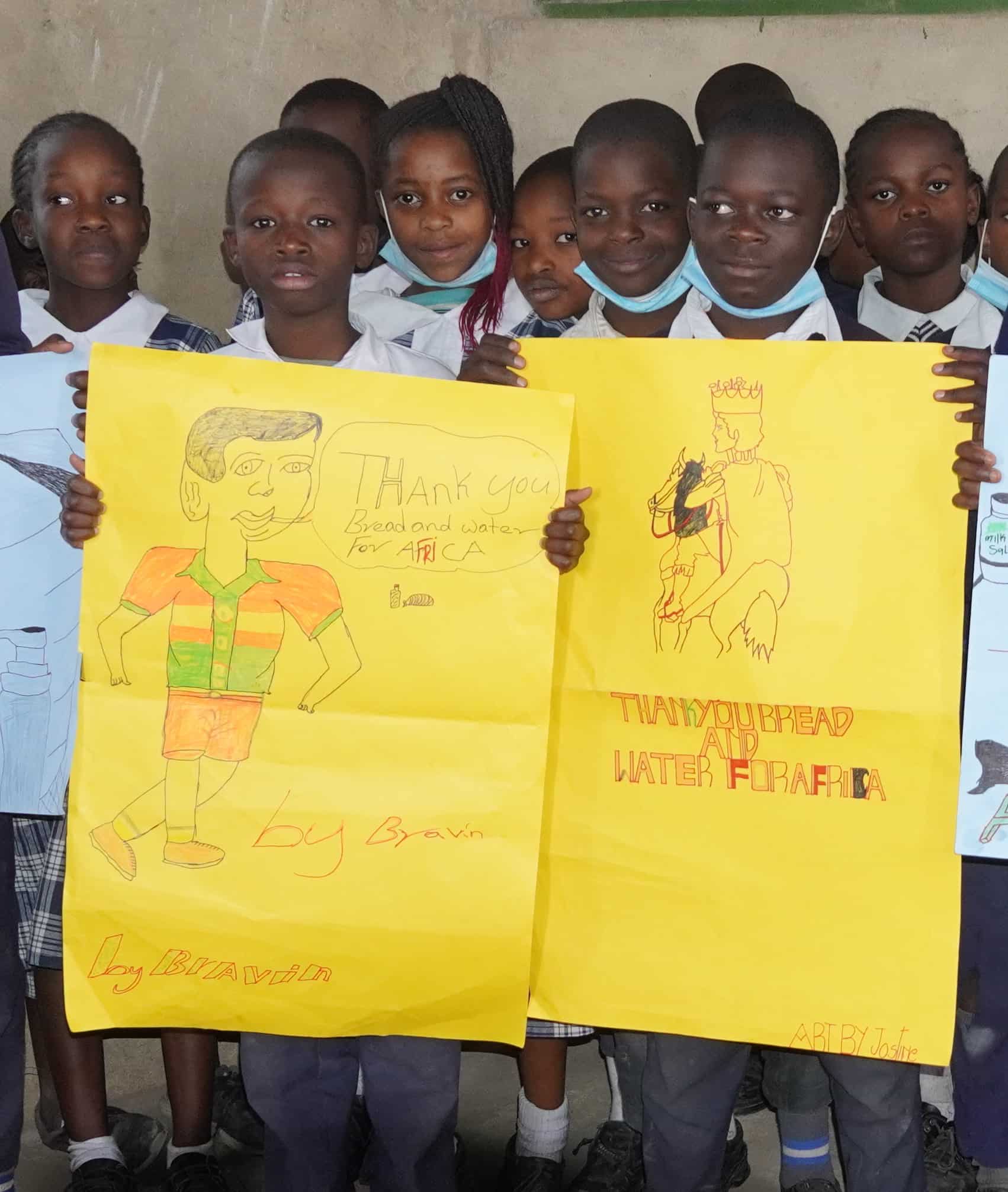 BWA - Seed School kids holding signs 2355 cropped left - Bread and ...